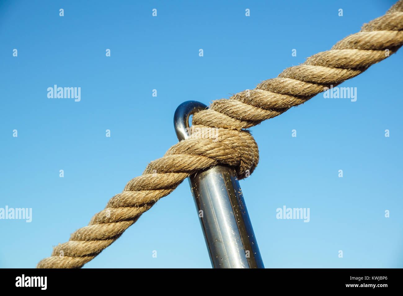 rope on metal pole, railing of beach walkway Stock Photo - Alamy