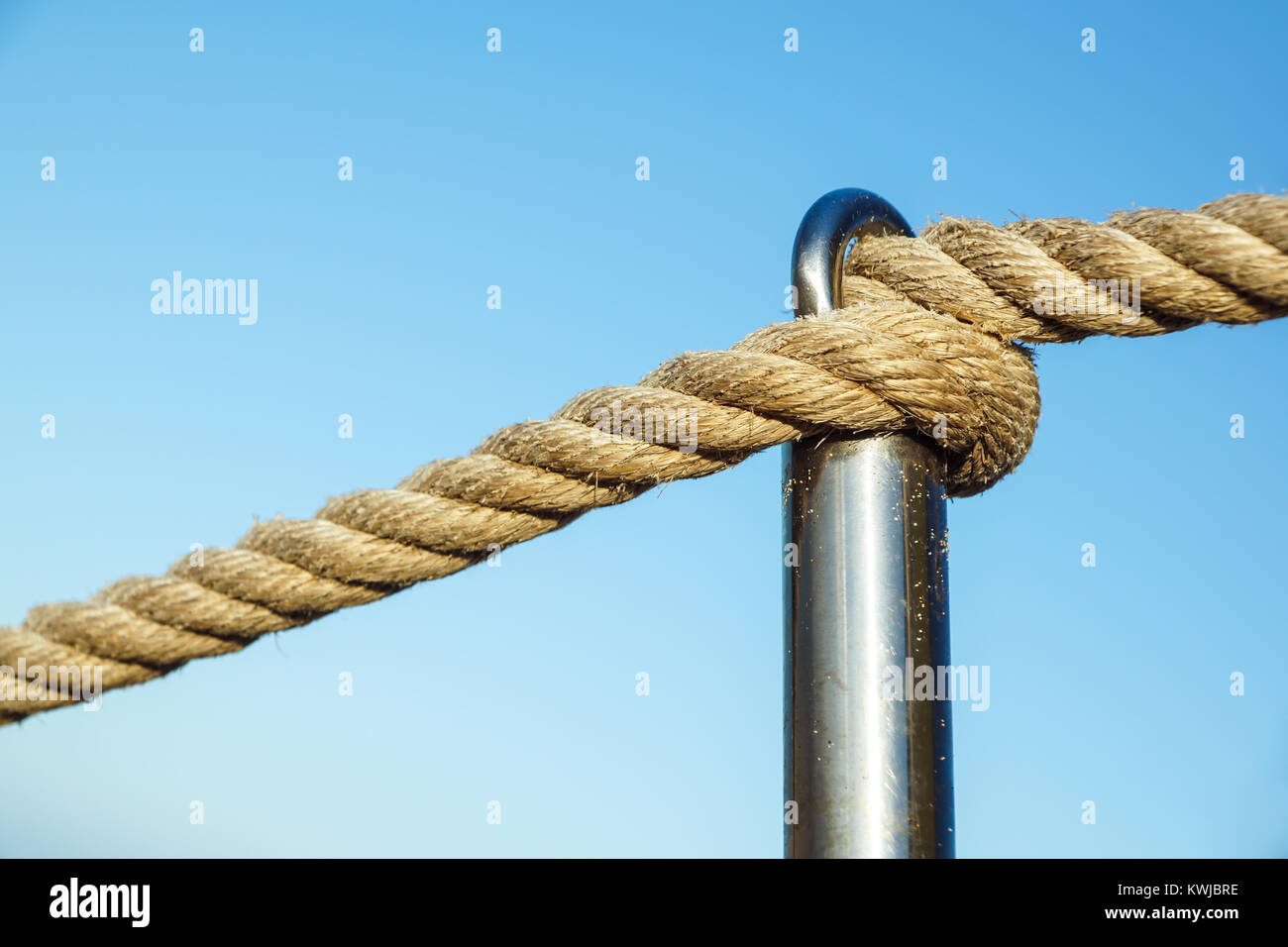 rope on metal pole, railing of beach walkway Stock Photo - Alamy