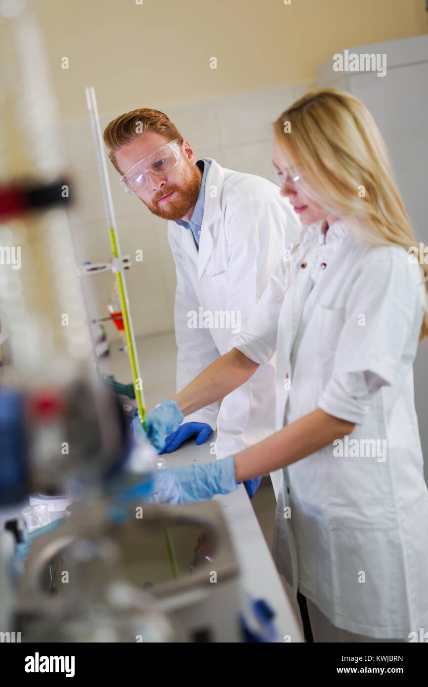 Group of students working at the laboratory Stock Photo - Alamy