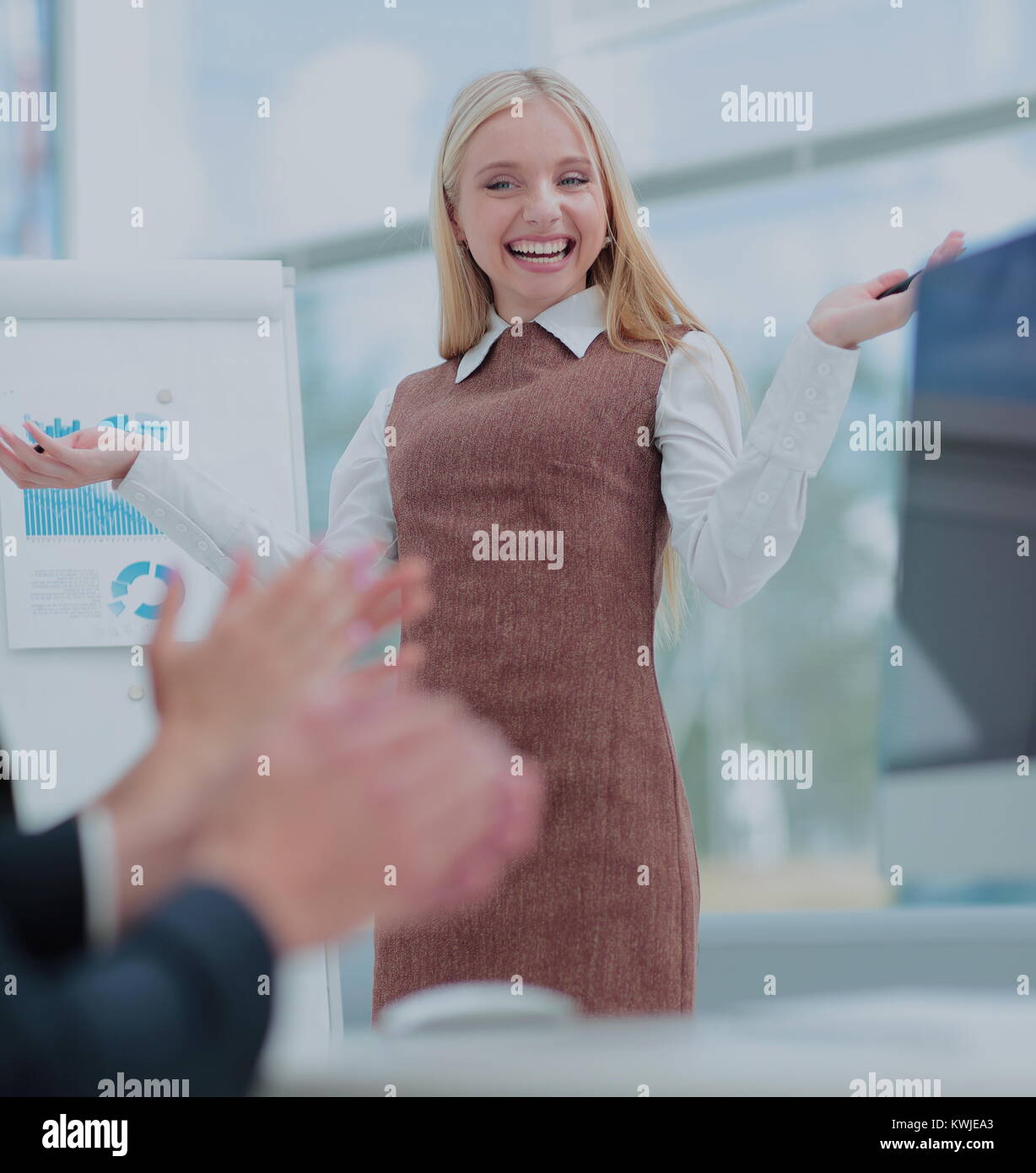 Attractive woman making a business presentation to a group Stock Photo ...