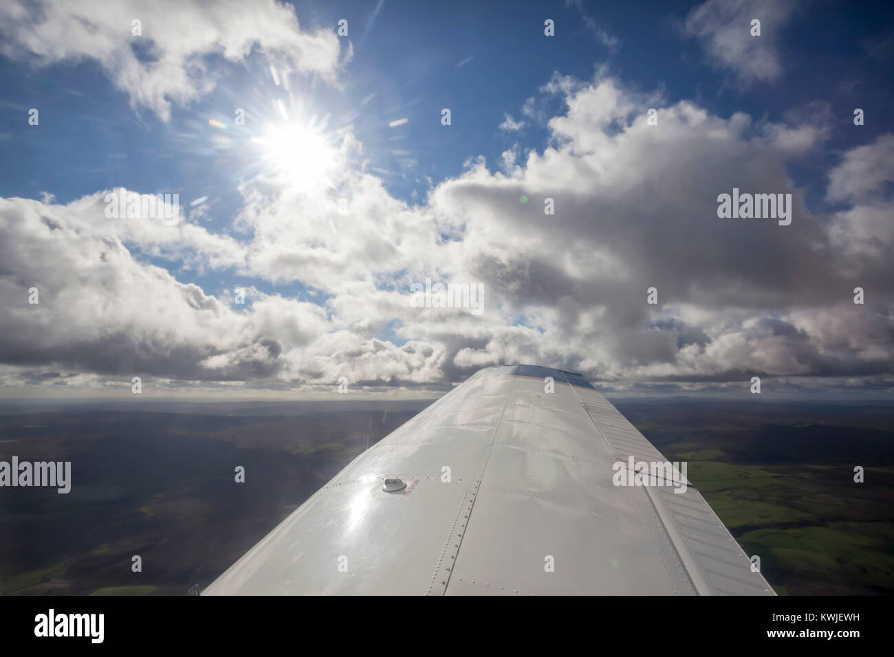 View over the wing out of a Piper PA-28 Cherokee light aircraft from ...