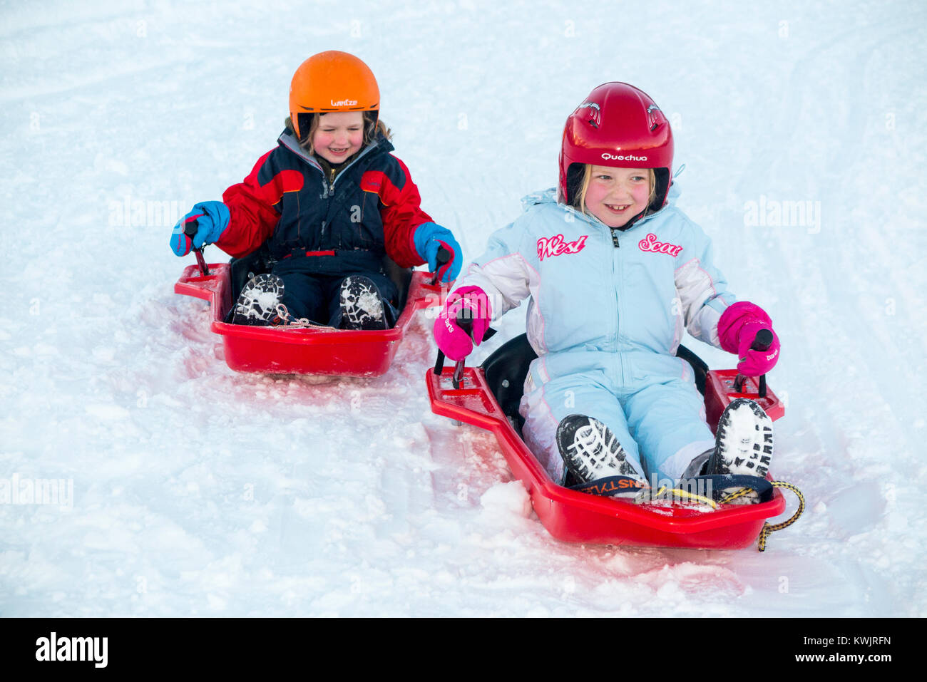 Girls, sisters, aged five, and seven years old, and and wearing ski ...