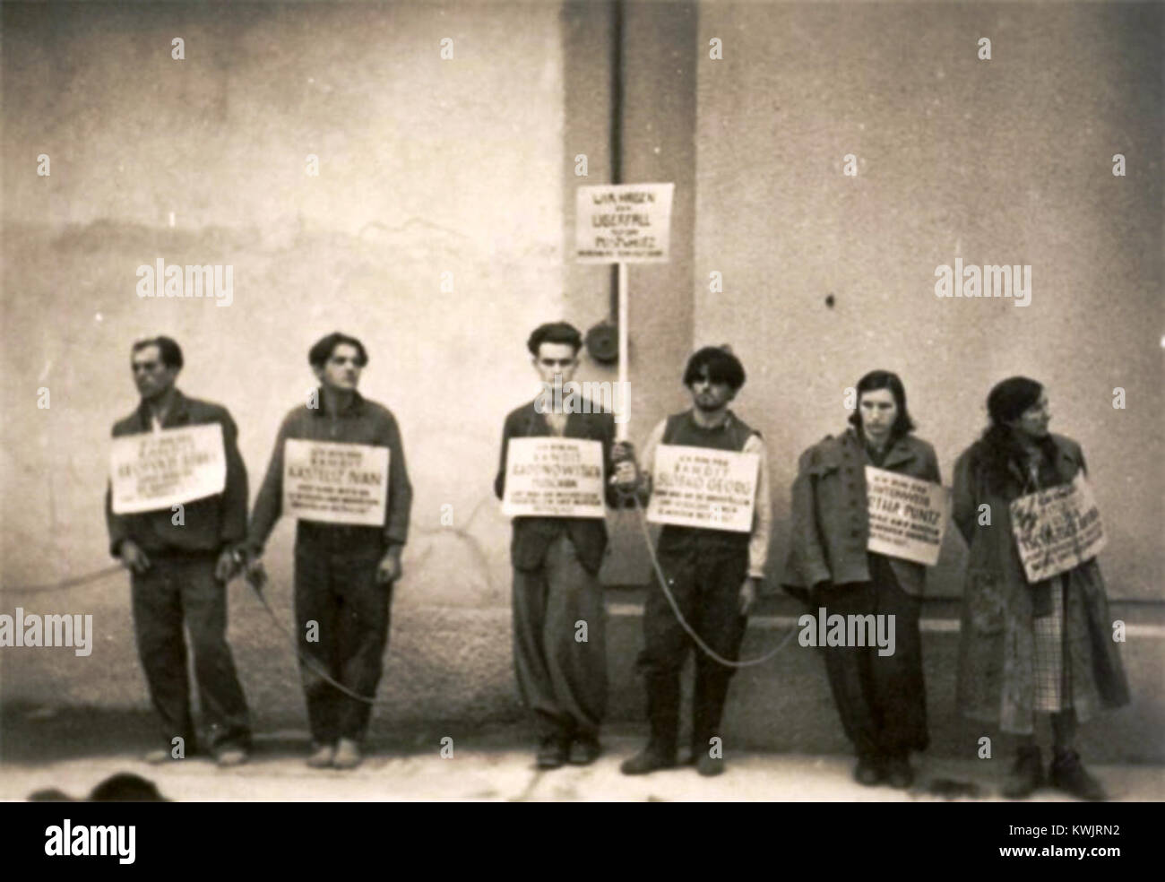 The photo caption records the mistreatment of captured and deceased ...
