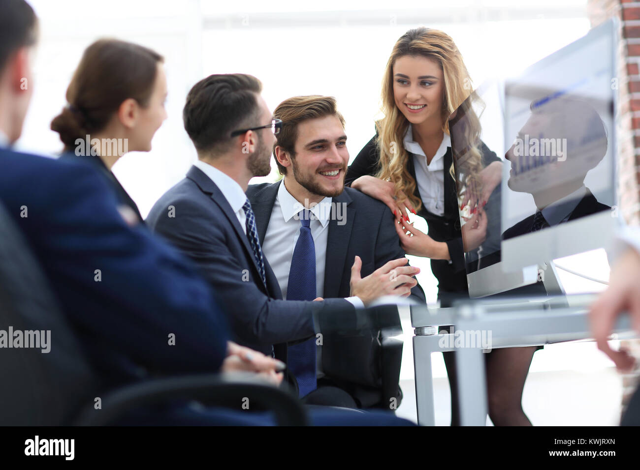 employees discussing financial charts Stock Photo - Alamy