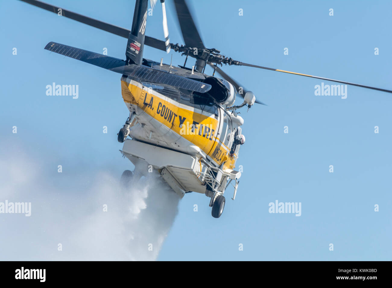 Los Angeles County Fire helicopter doing a water drop on a brush fire ...