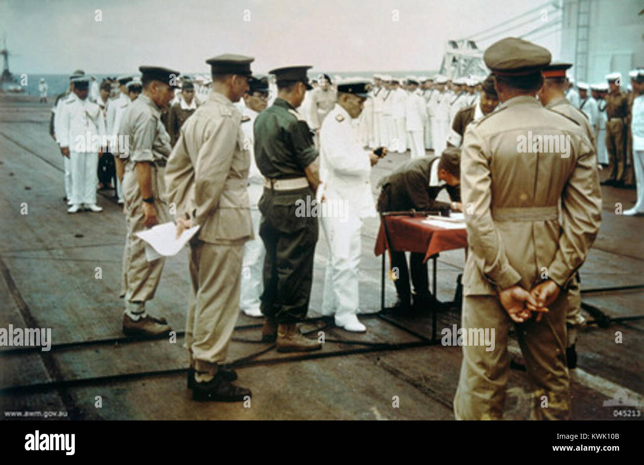 Japanese signing surrender Rabaul on HMS Glory (R62) 1945 Stock Photo ...