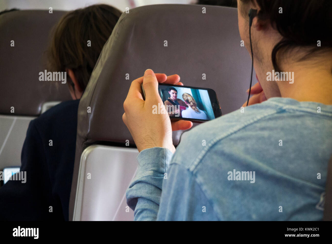 Male inflight movie plane hi-res stock photography and images - Alamy