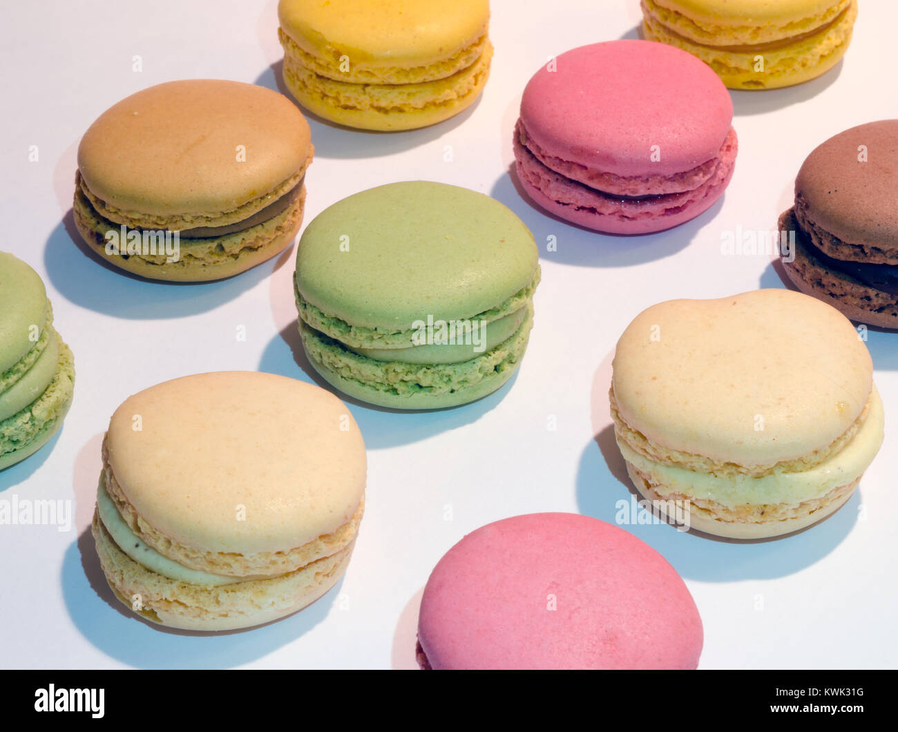 Ten macarons in different colours lined up on a white background Stock ...