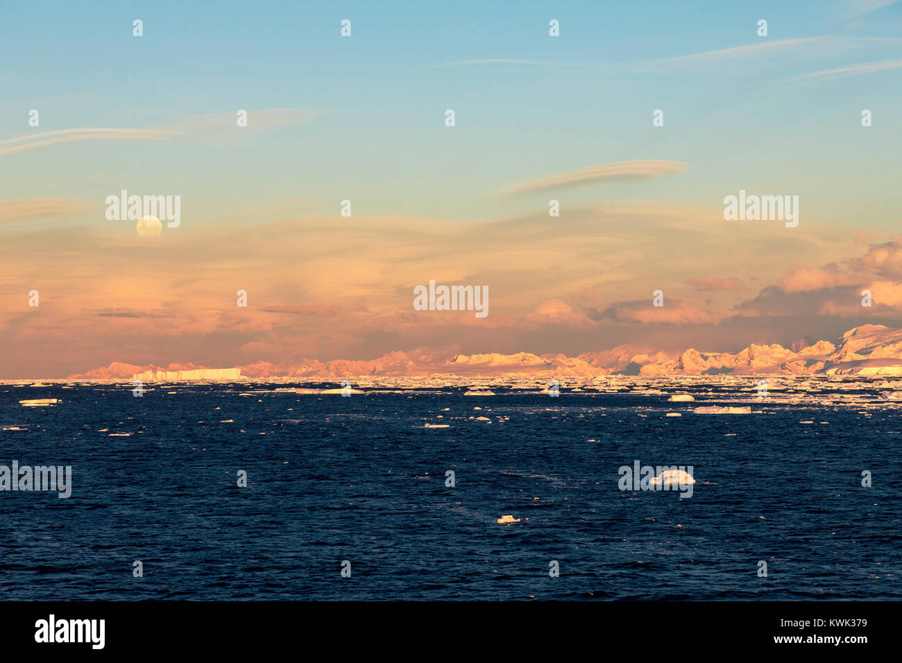 Full moon rising over Antarctica landscape; Rongé Island; Arctowski ...