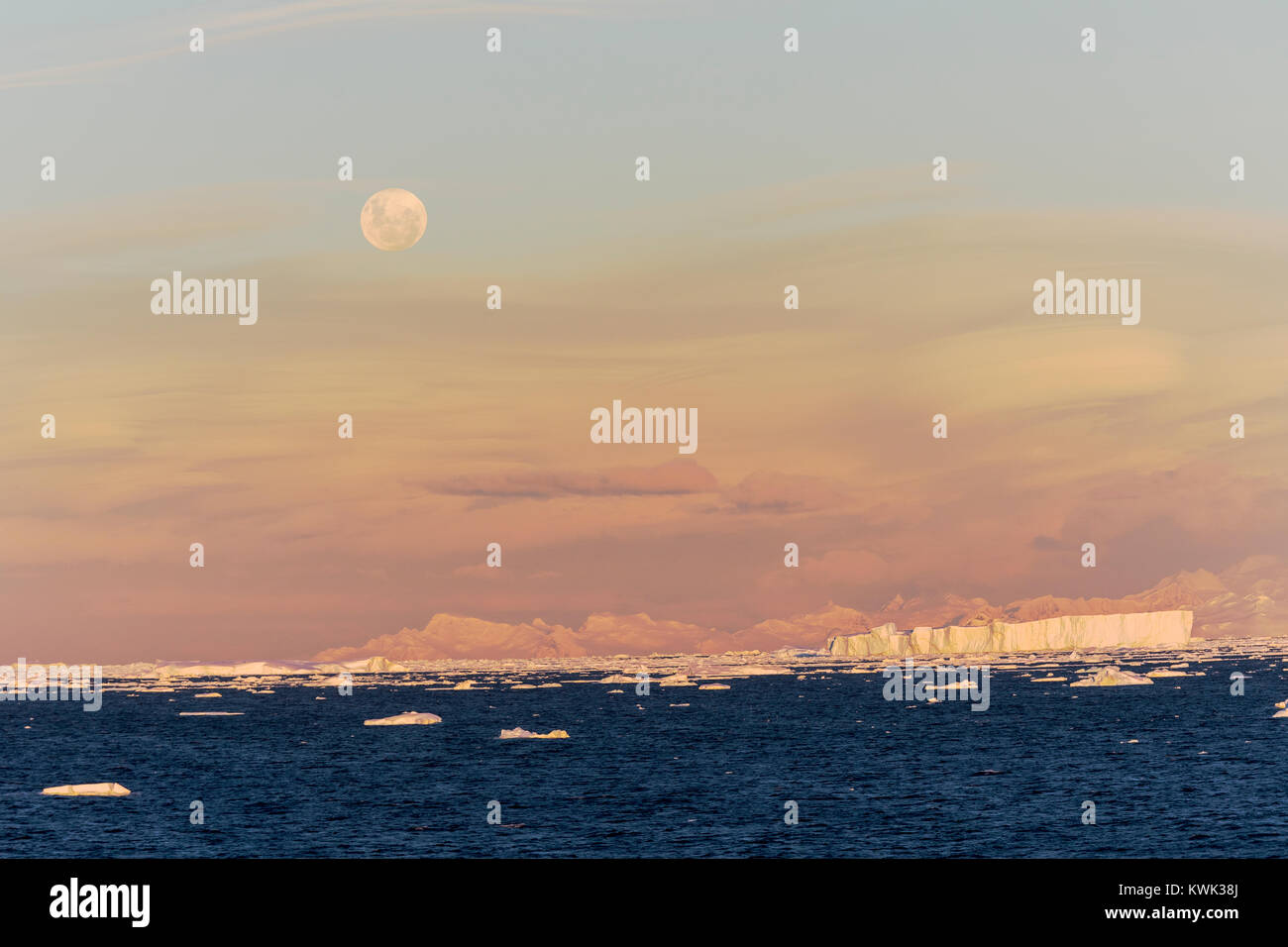 Full moon rising over Antarctica landscape; Rongé Island; Arctowski ...