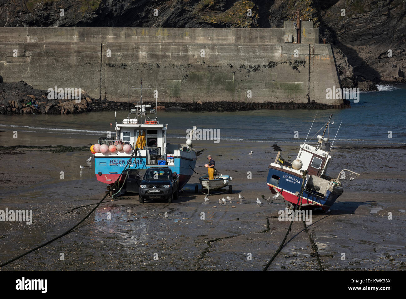 Fishing boats in harbour at Doc Martin fishing village Stock Photo - Alamy