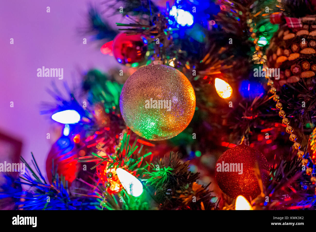 The yellow ball garland on the Christmas tree Stock Photo - Alamy