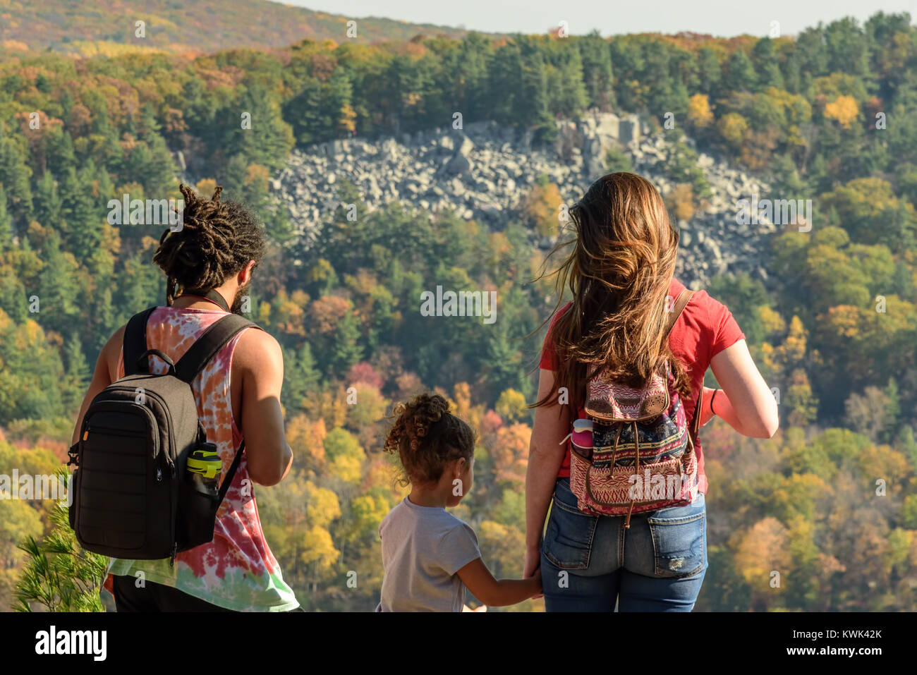 young family looking at fall colors from top of west bluff at Devils ...