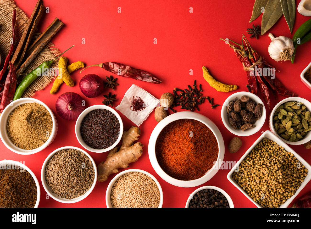 Raw Indian Spice Powder over red, green or yellow background, selective ...