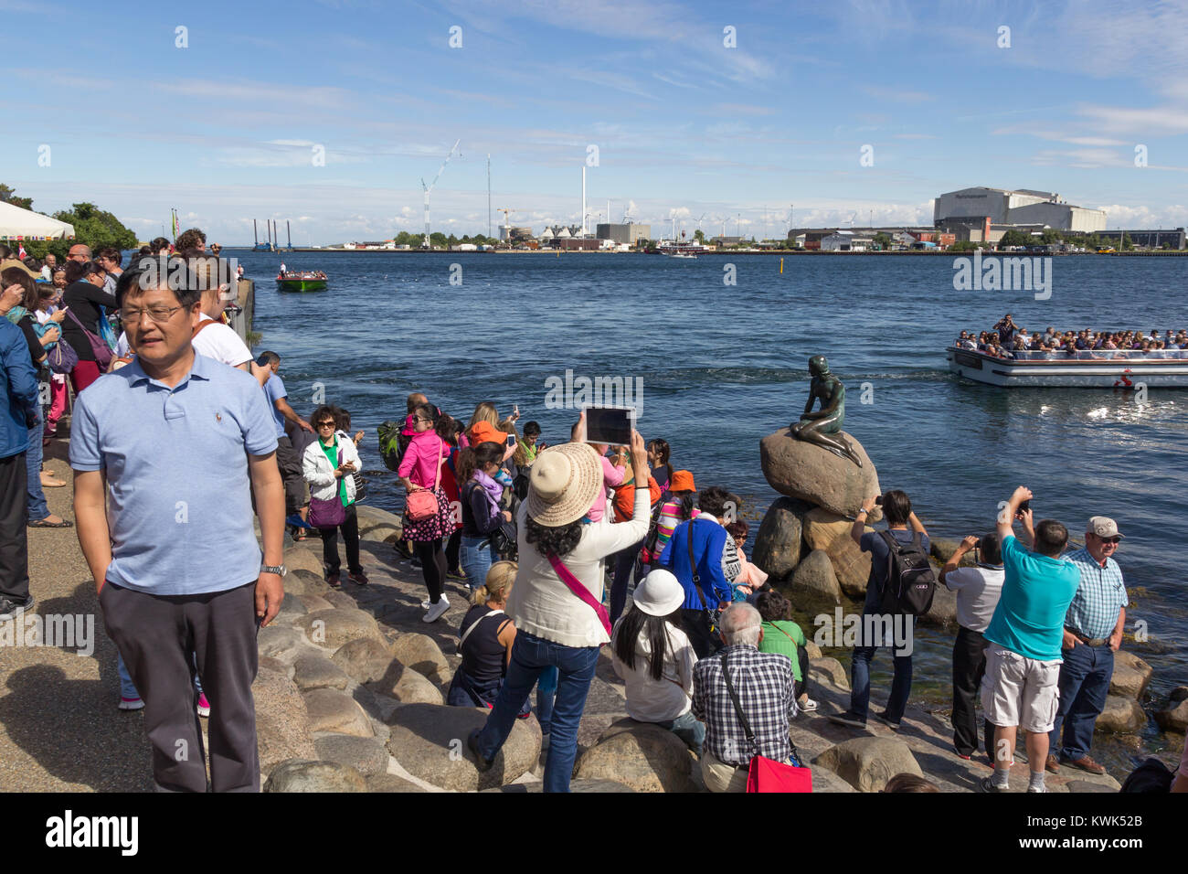 Tourists by The Little Mermaid (bronze statue by Edvard Eriksen, 1913), Copenhagen, Denmark ...