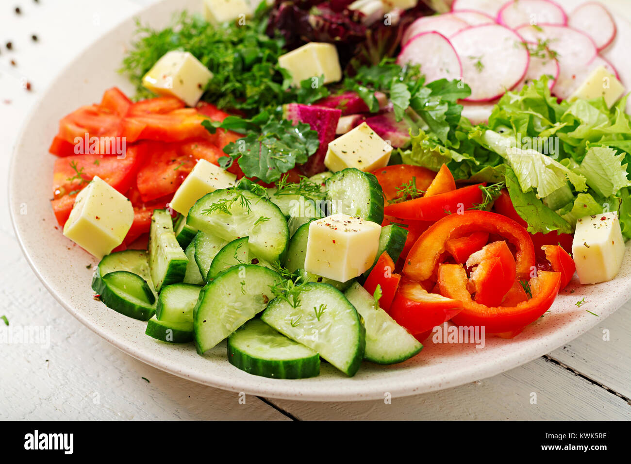 Mix salad from fresh vegetables and greens herbs. Dietary menu. Proper ...