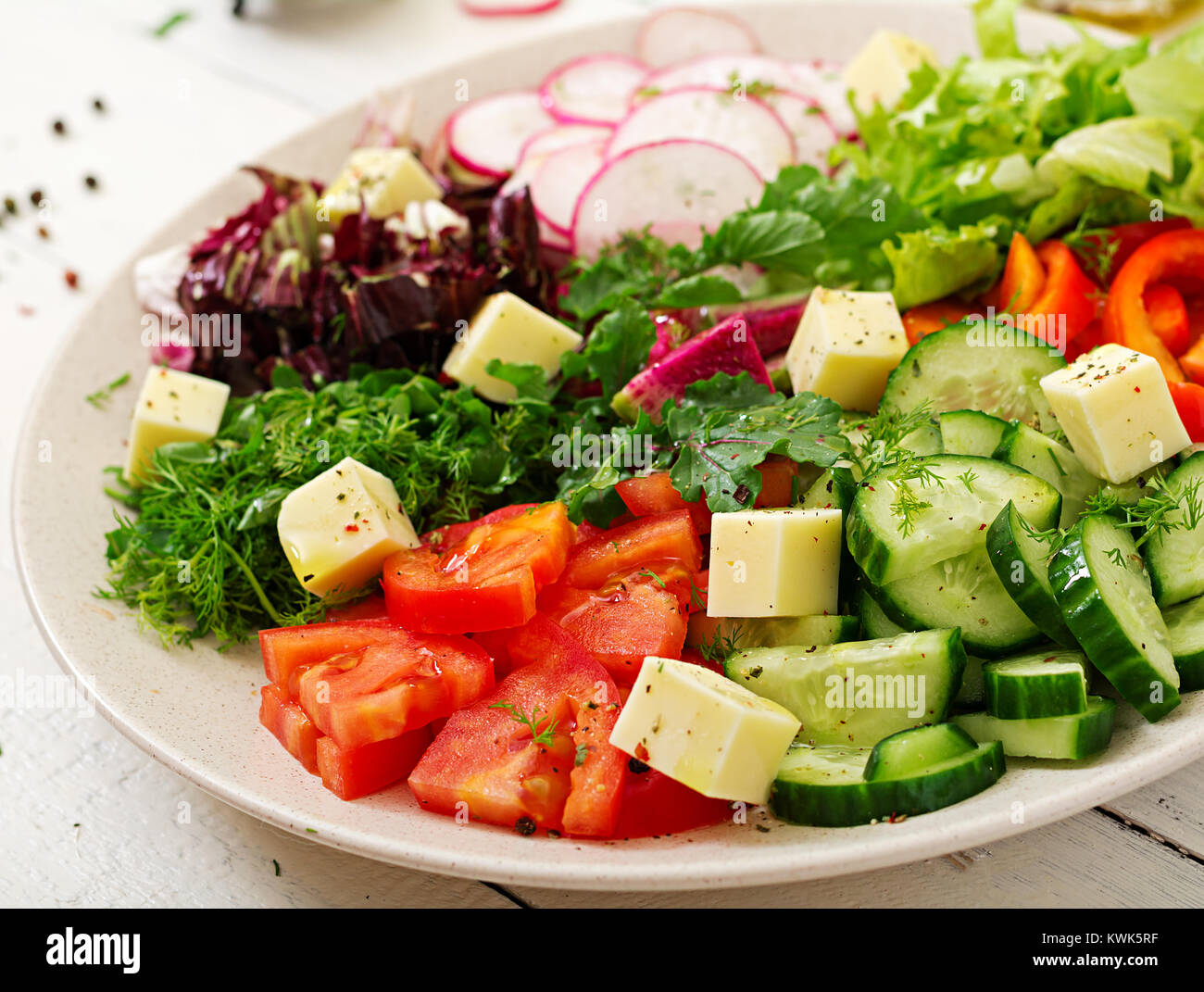 Mix salad from fresh vegetables and greens herbs. Dietary menu. Proper ...