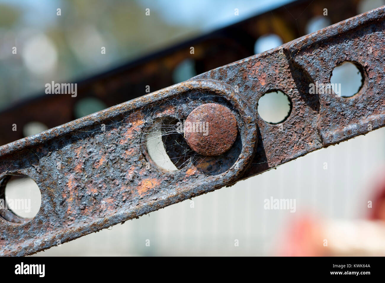 Abstract textures and shapes: Aging metal braces and bolts, making up a ...