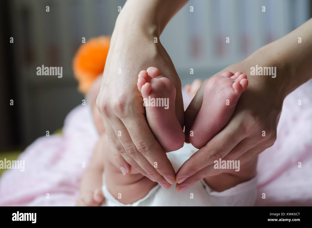 Baby feet in mother hands.baby is sleeping Stock Photo - Alamy