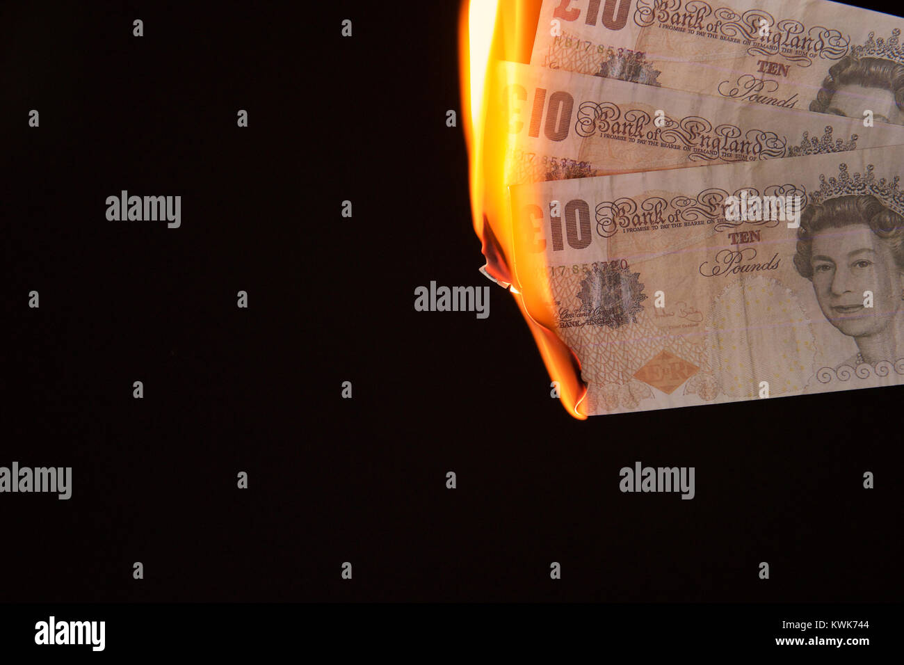 Concept - burning your cash Stock Photo - Alamy