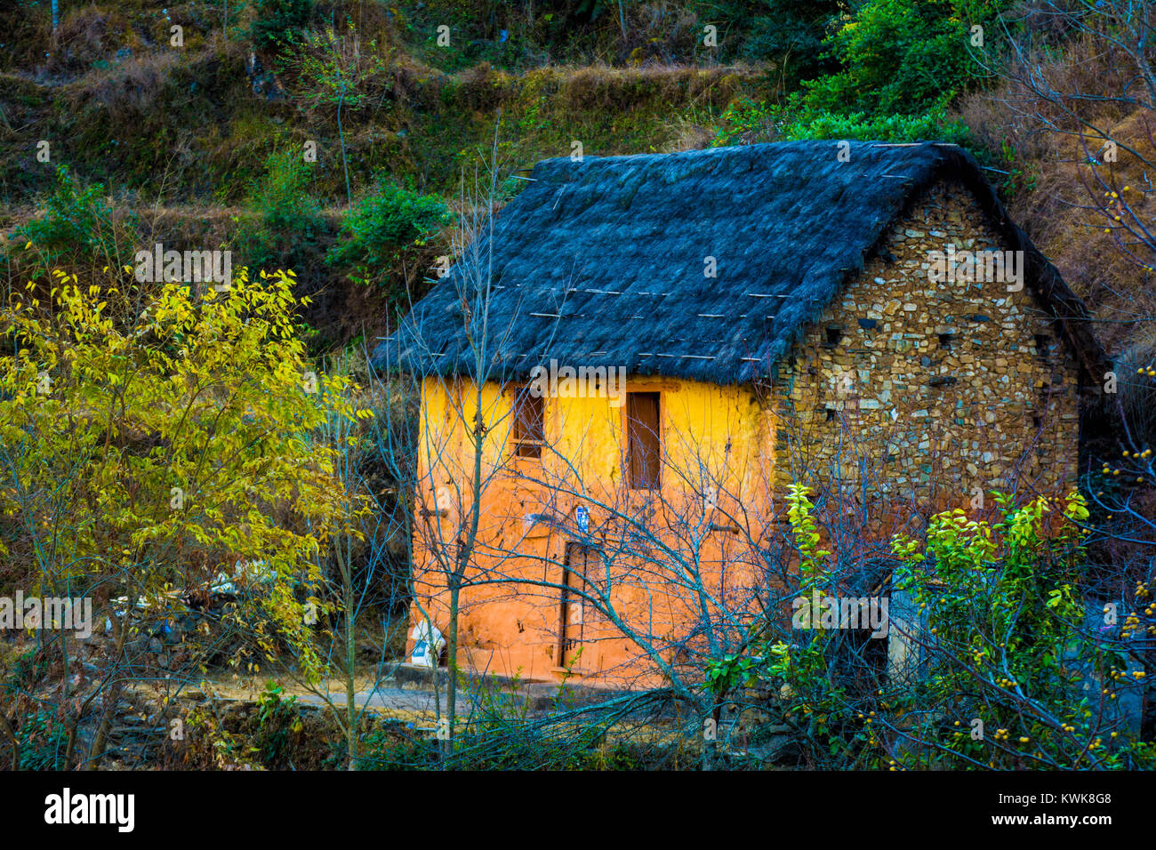 Beautiful tiny orange village house Stock Photo - Alamy