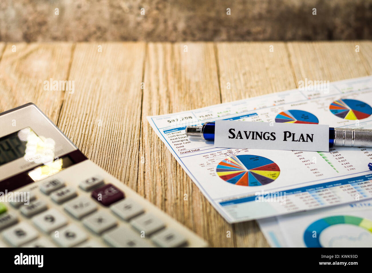 Savings Plan motivational concept with charts and graphs and calculator ...