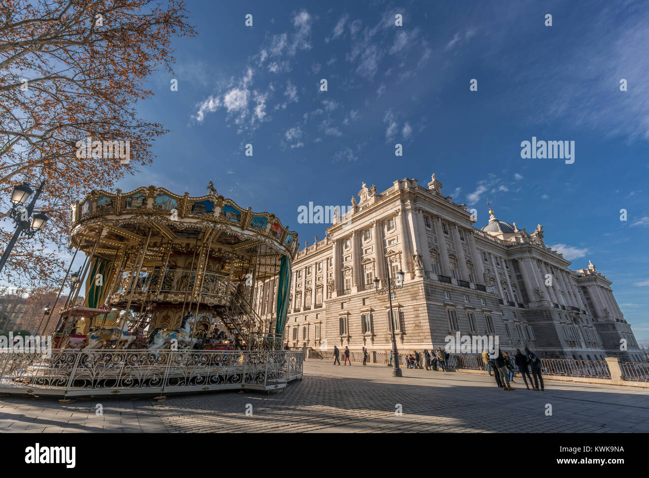 Tourists and local people walking and enjoying Colorful carousel ...