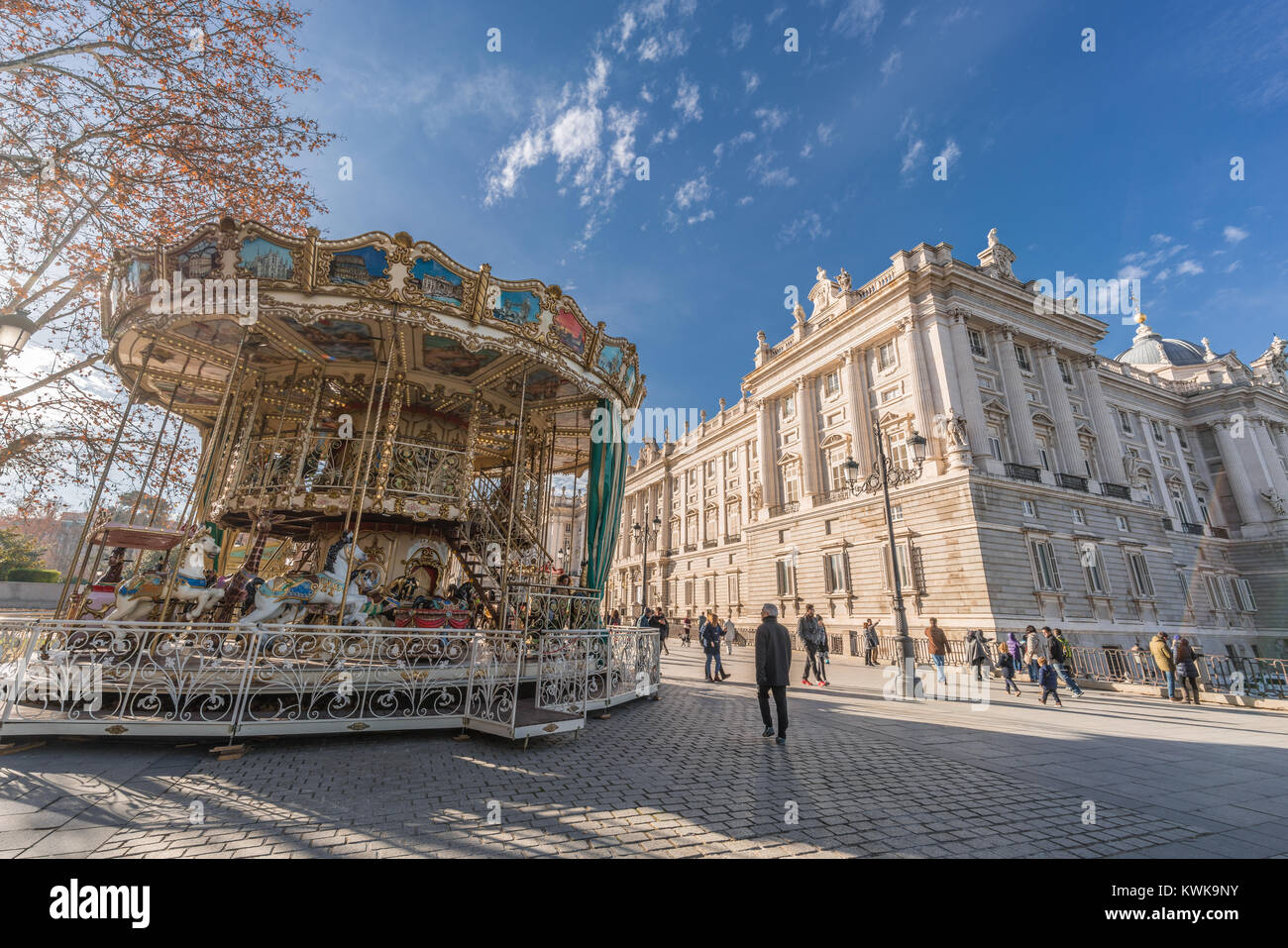 Tourists and local people walking and enjoying Colorful carousel ...