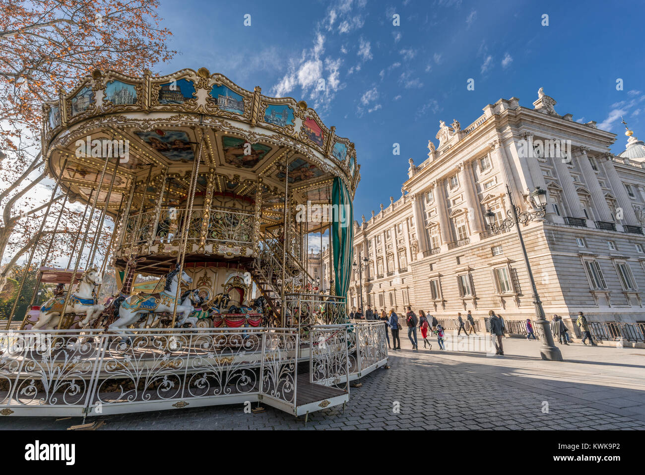 Tourists and local people walking and enjoying Colorful carousel ...
