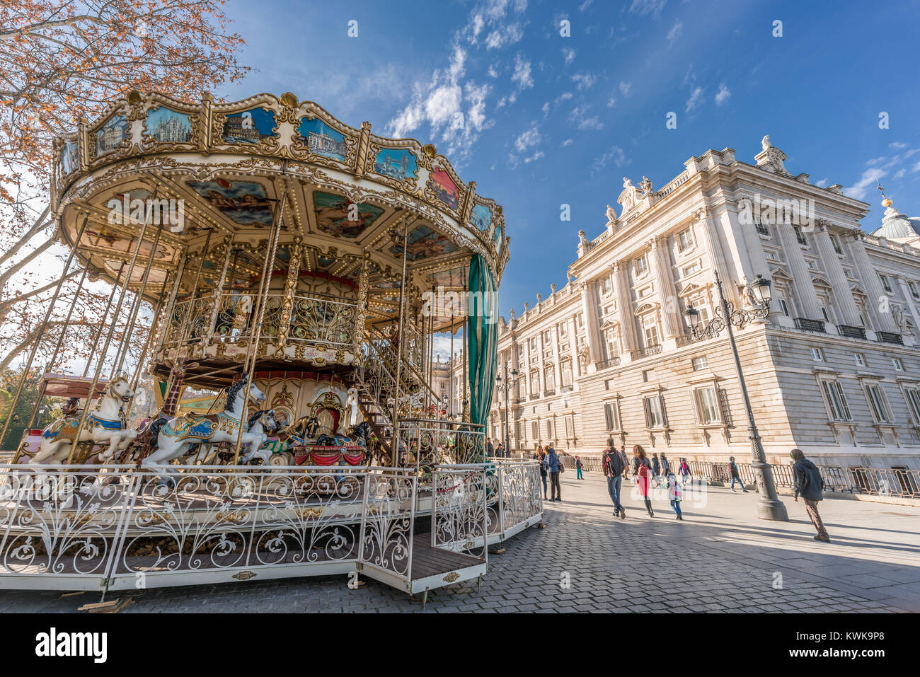 Tourists and local people walking and enjoying Colorful carousel ...
