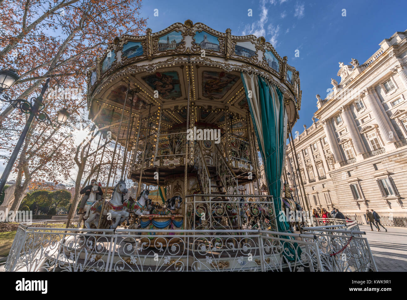 Tourists and local people walking and enjoying Colorful carousel ...