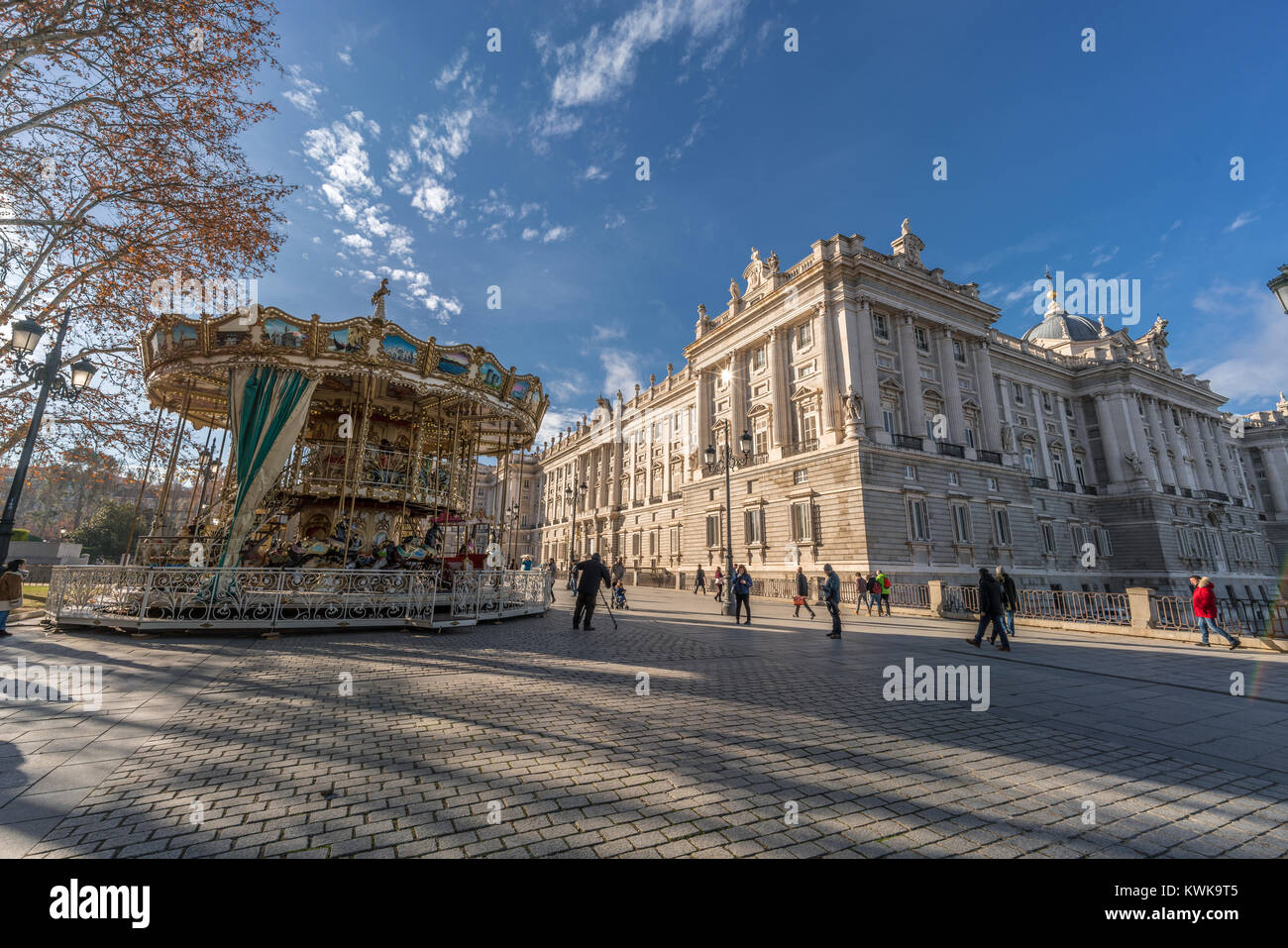Tourists and local people walking and enjoying Colorful carousel ...