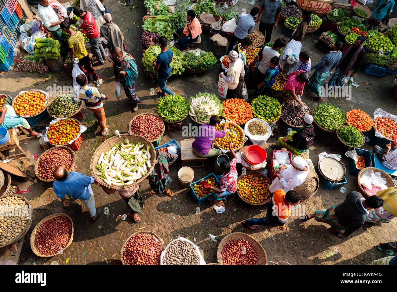 Overview of the street scene at a local vegetable market in Dhaka ...