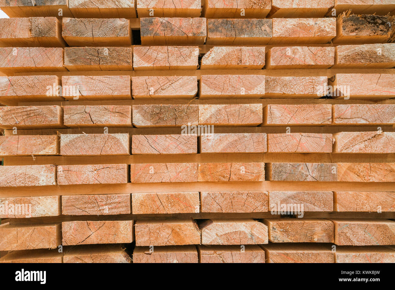 Wooden planks to build a house on a stack of folded construction base ...