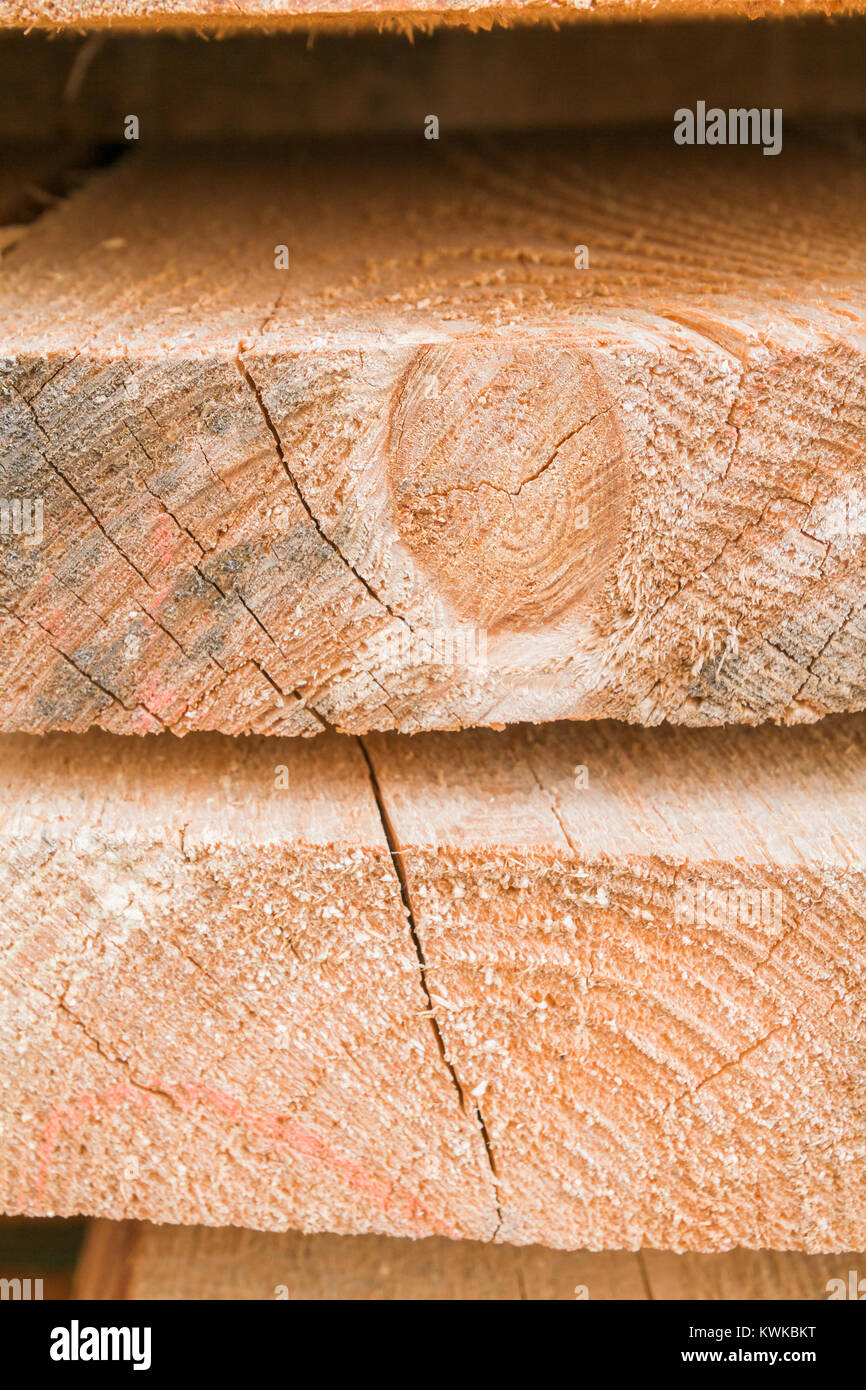 Wooden planks to build a house on a stack of folded construction base ...