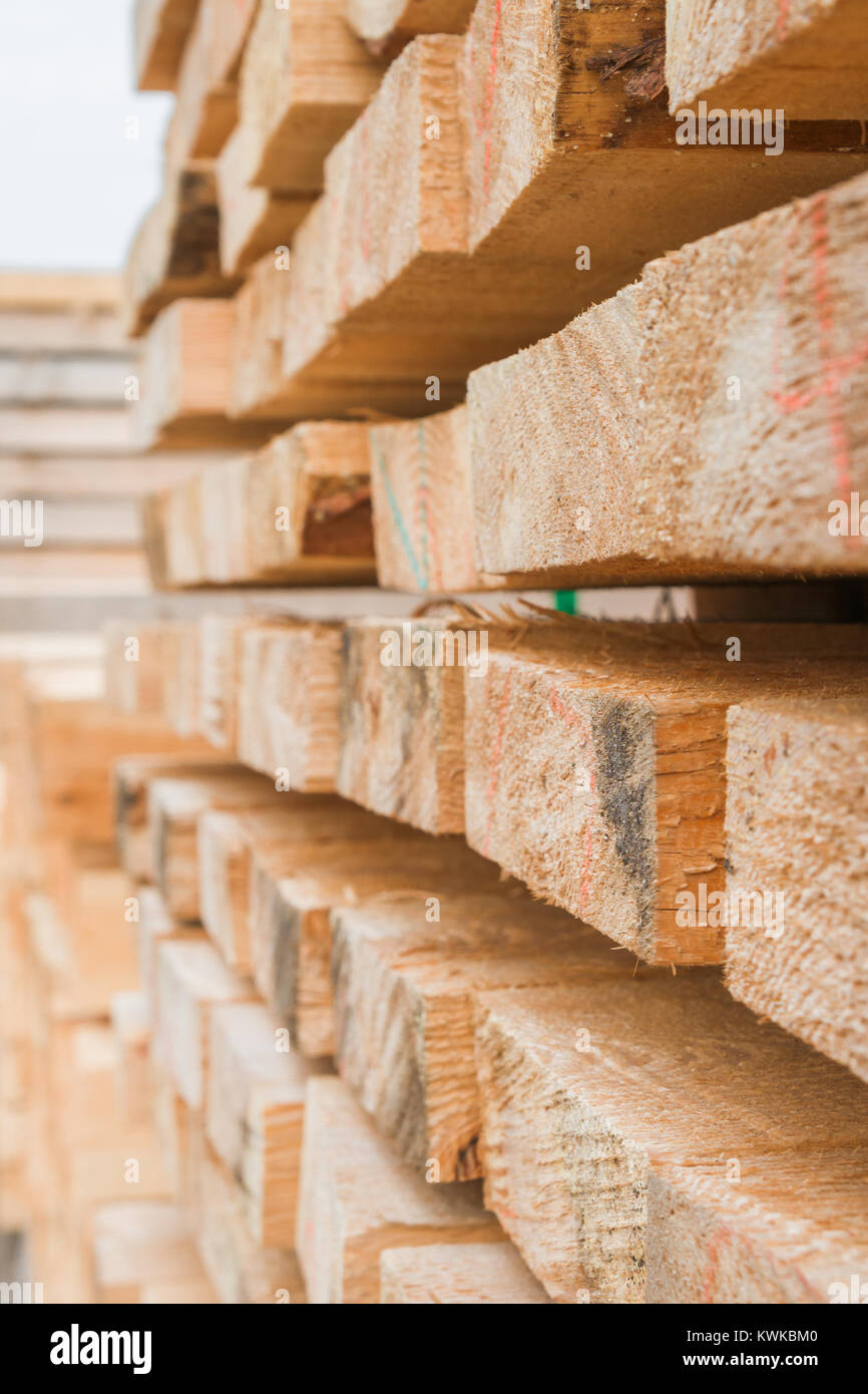 Wooden planks to build a house on a stack of folded construction base ...