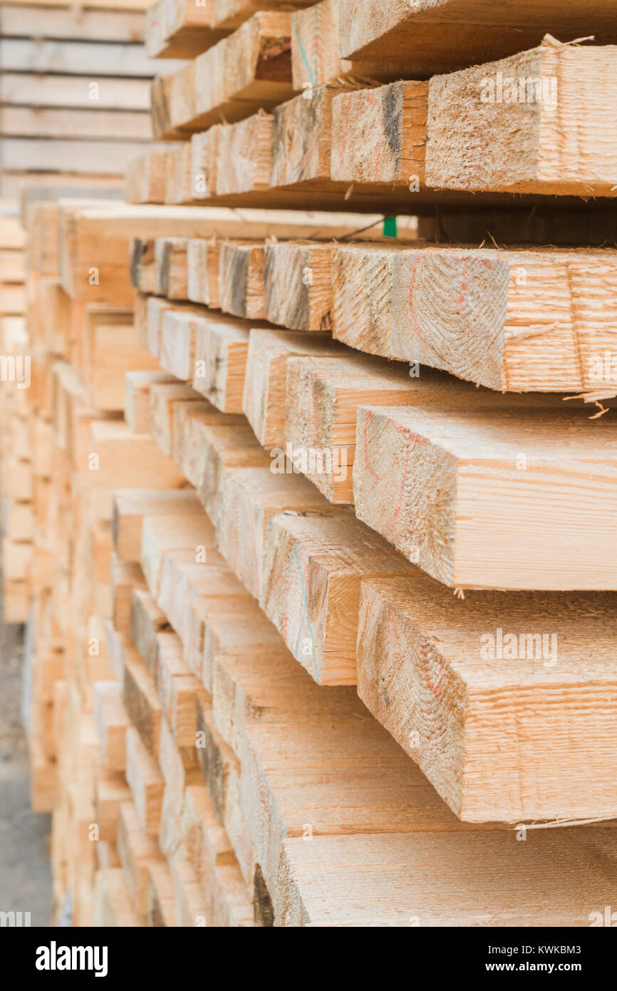 Wooden planks to build a house on a stack of folded construction base ...