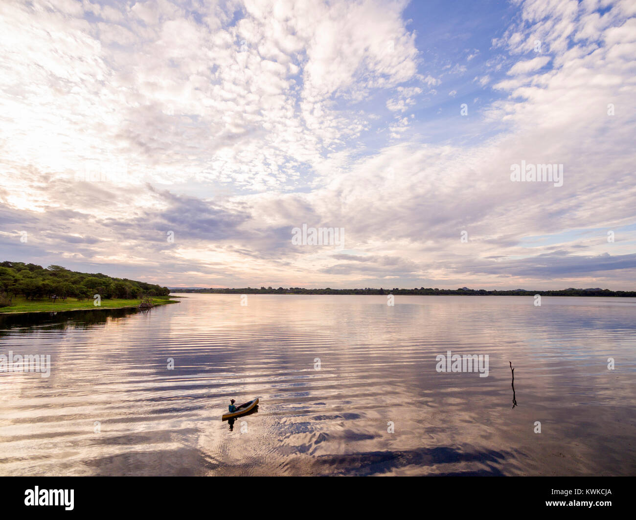 An aerial view of man fishing in a canoe Stock Photo - Alamy
