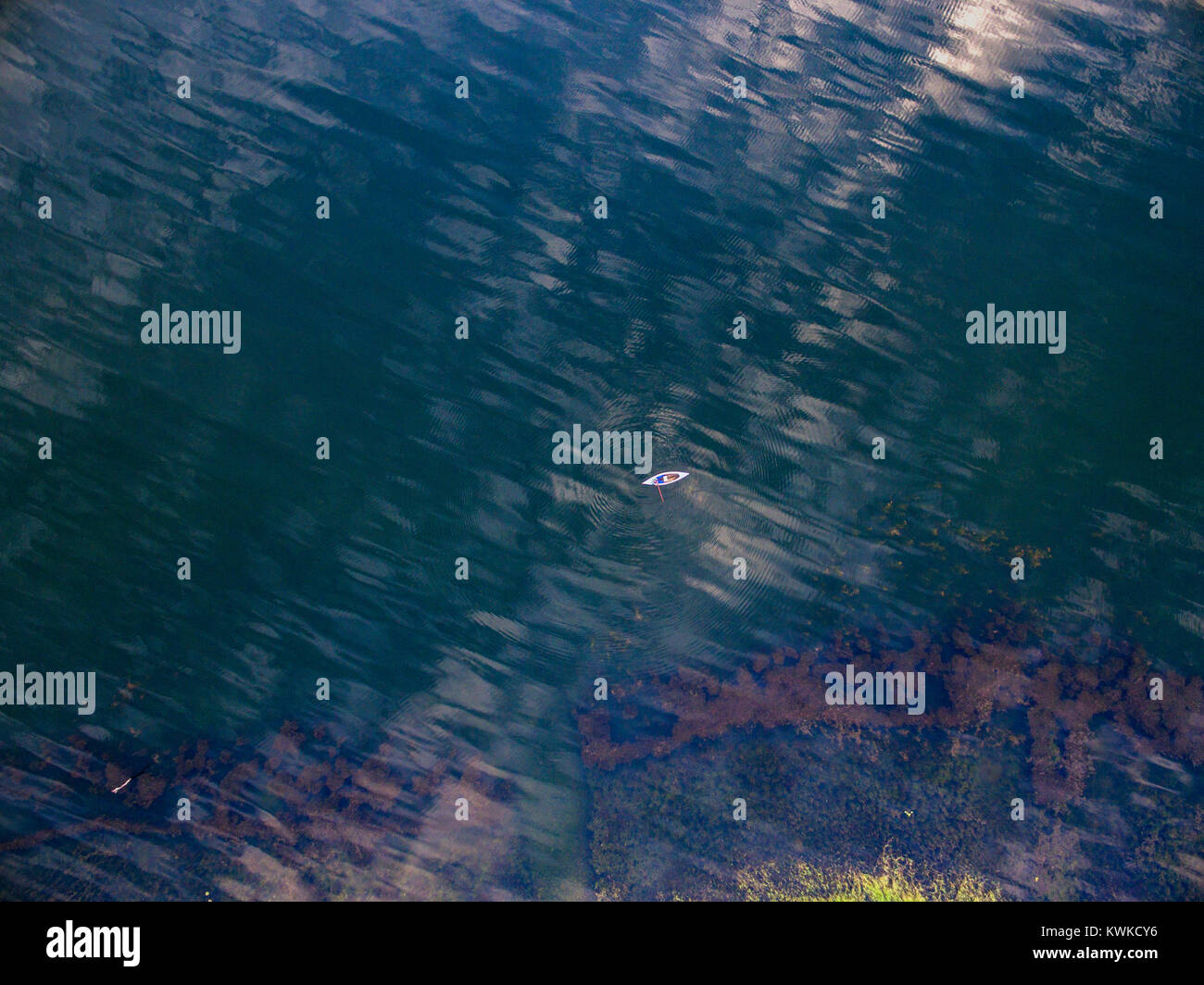 An aerial view of man fishing in a canoe Stock Photo - Alamy