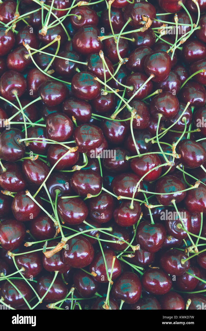 Ripe red cherries in the market on the counter Stock Photo - Alamy