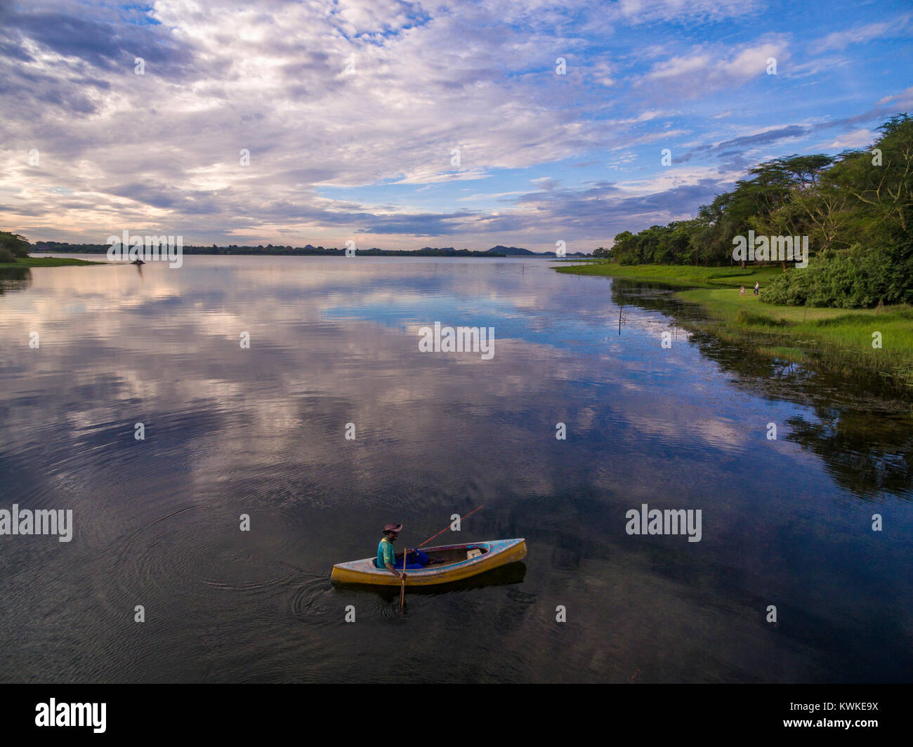 An aerial view of man fishing in a canoe Stock Photo - Alamy