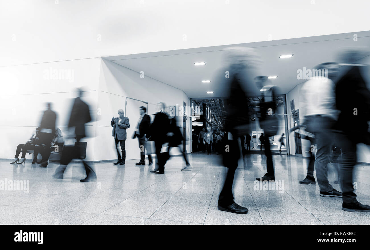 crowd of people rushing in trade fair hall Stock Photo - Alamy