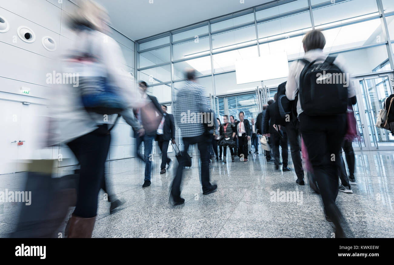 crowd of commuters rushing in a entrance, including copy space banner ...