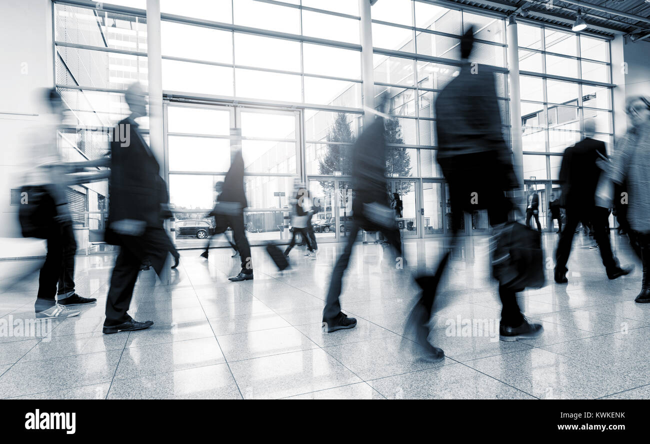 business people rushing in modern floor Stock Photo - Alamy