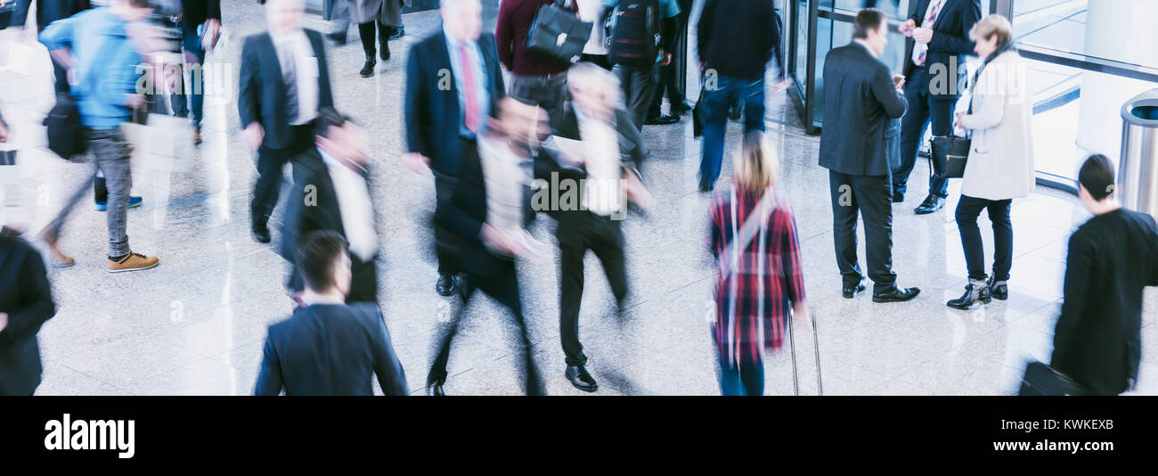 crowd of business people rushing in a modern hall Stock Photo - Alamy