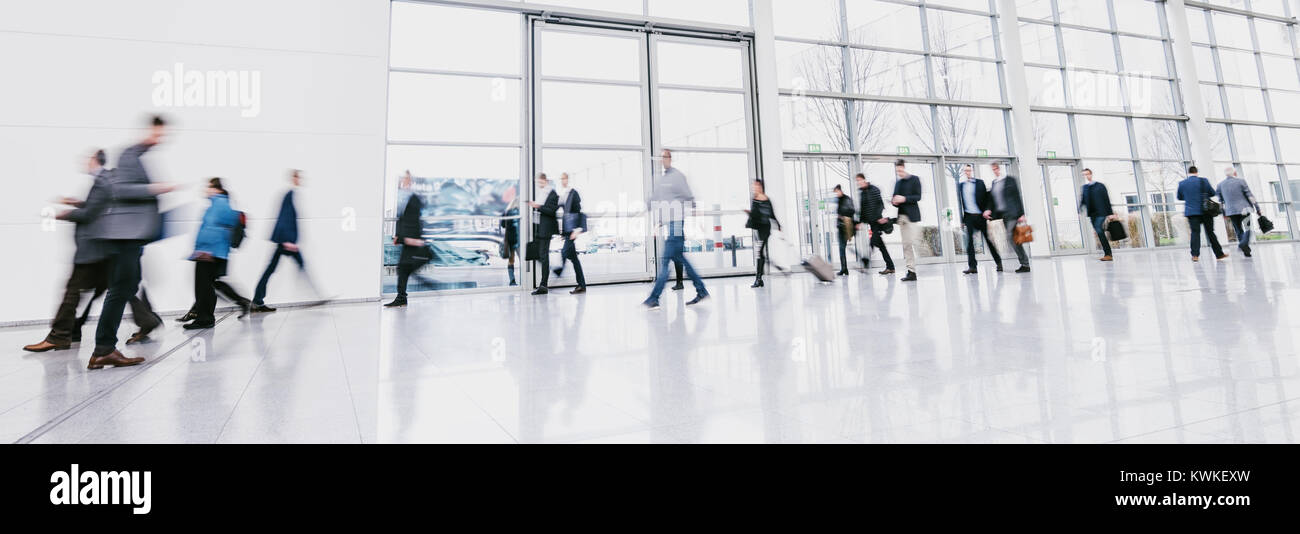 crowd of people walking at in a floor of a business center Stock Photo ...