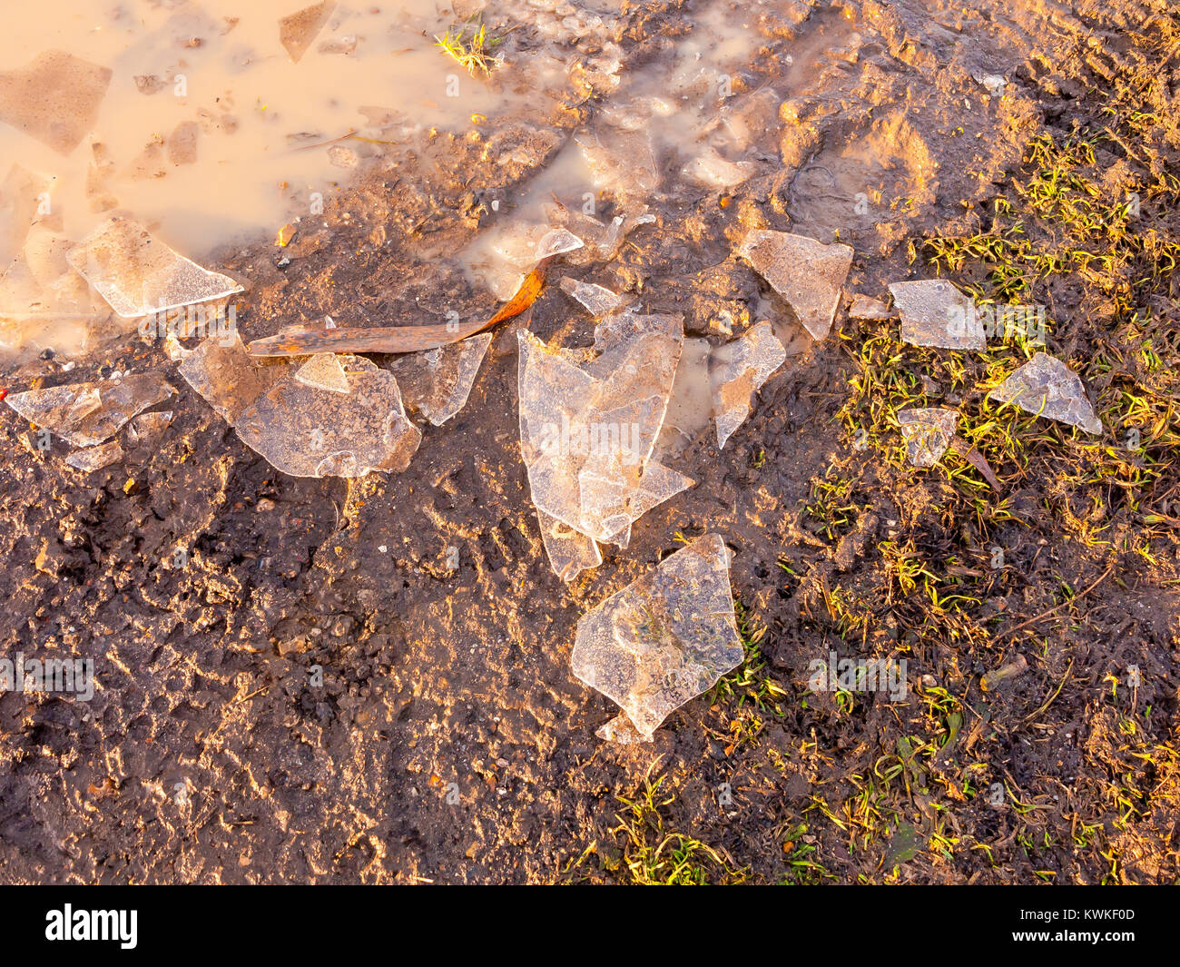 broken ice on mud floor walk surface outside texture winter frost ...