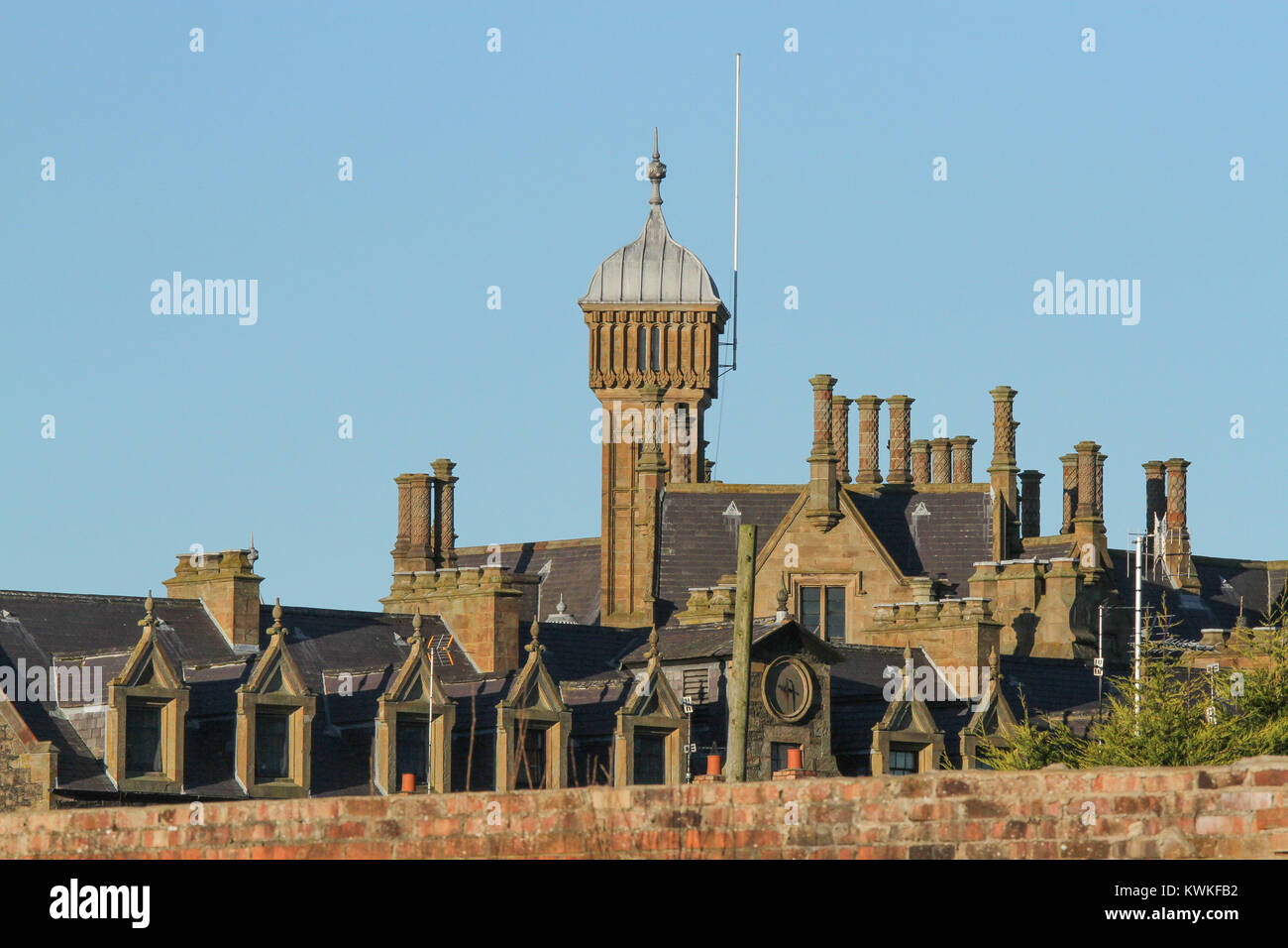 The ornate chimney stacks of Brownlow House alongside modern chimneys ...