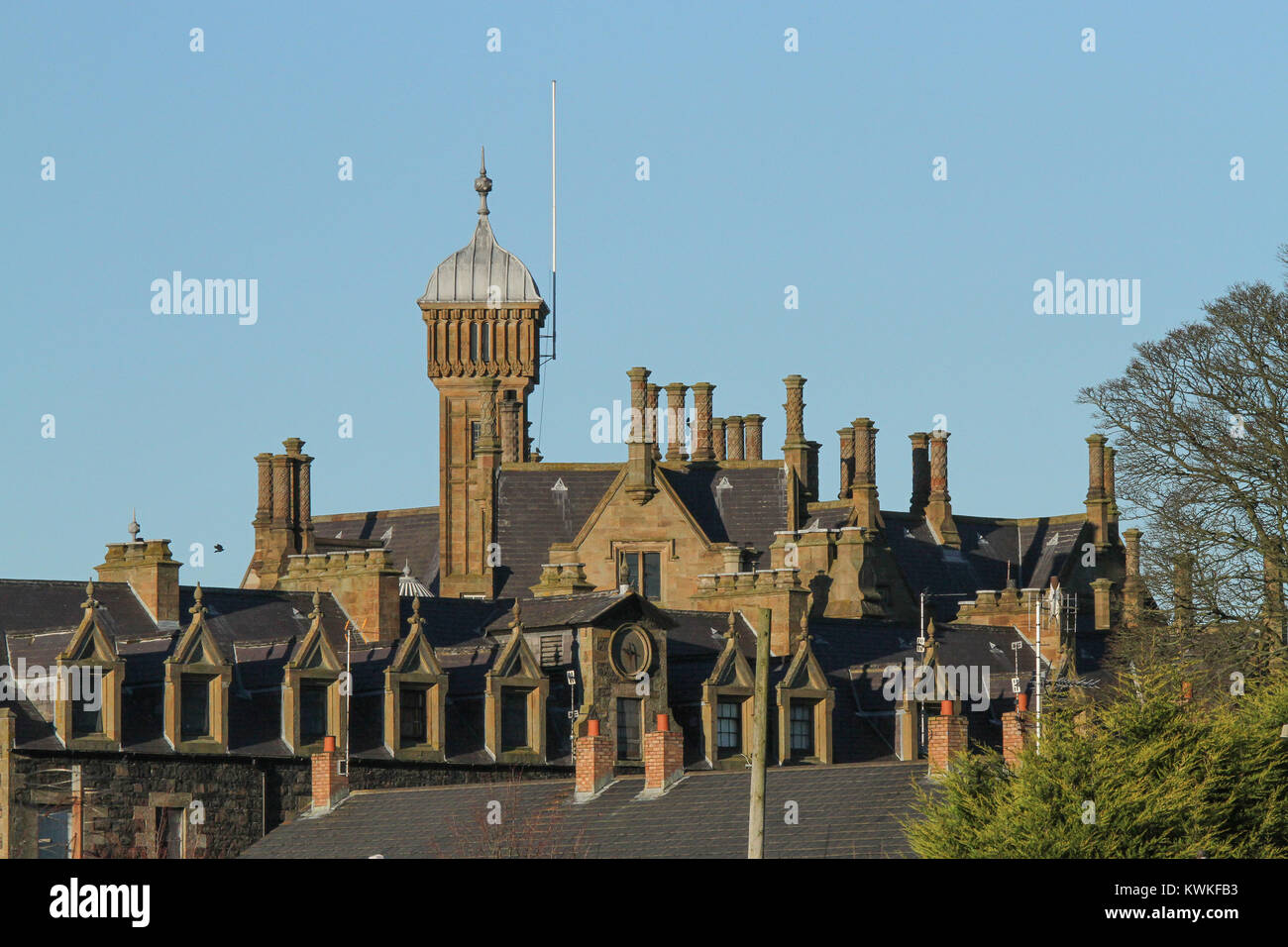 The ornate chimney stacks of Brownlow House alongside modern chimneys ...