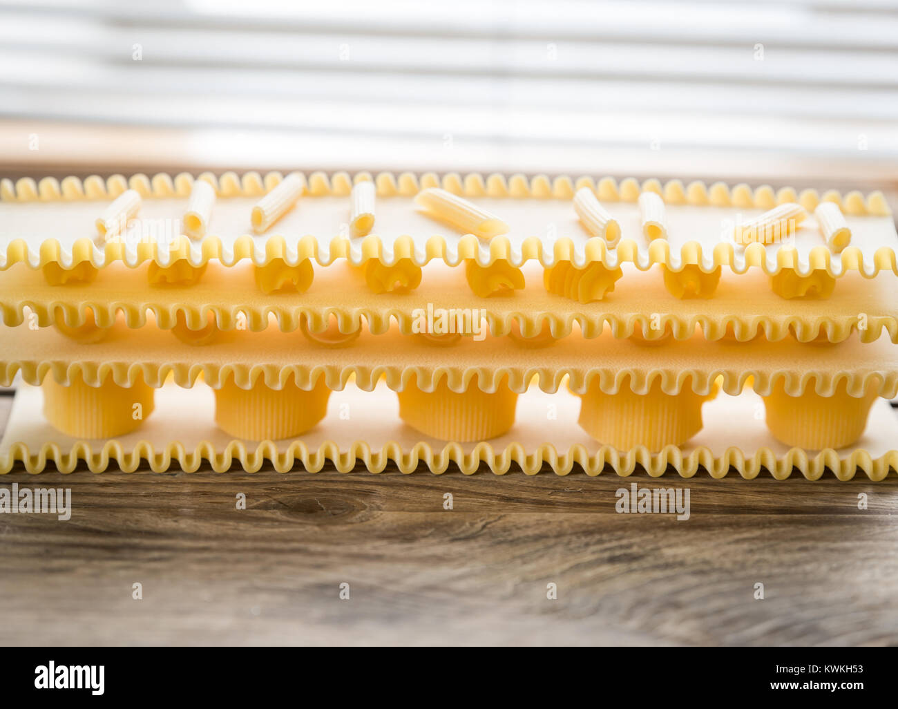Various types of pasta on lasagne sheets Stock Photo - Alamy